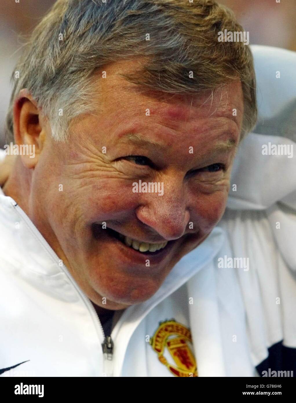 Manchester United manager Sir Alex Ferguson shares a joke before his ...