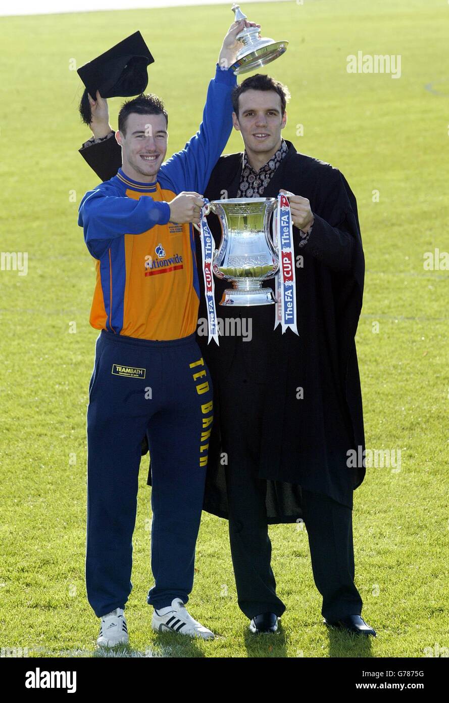 Team Bath Captain Kevin Watson (left) holds the FA Cup with teammate ...