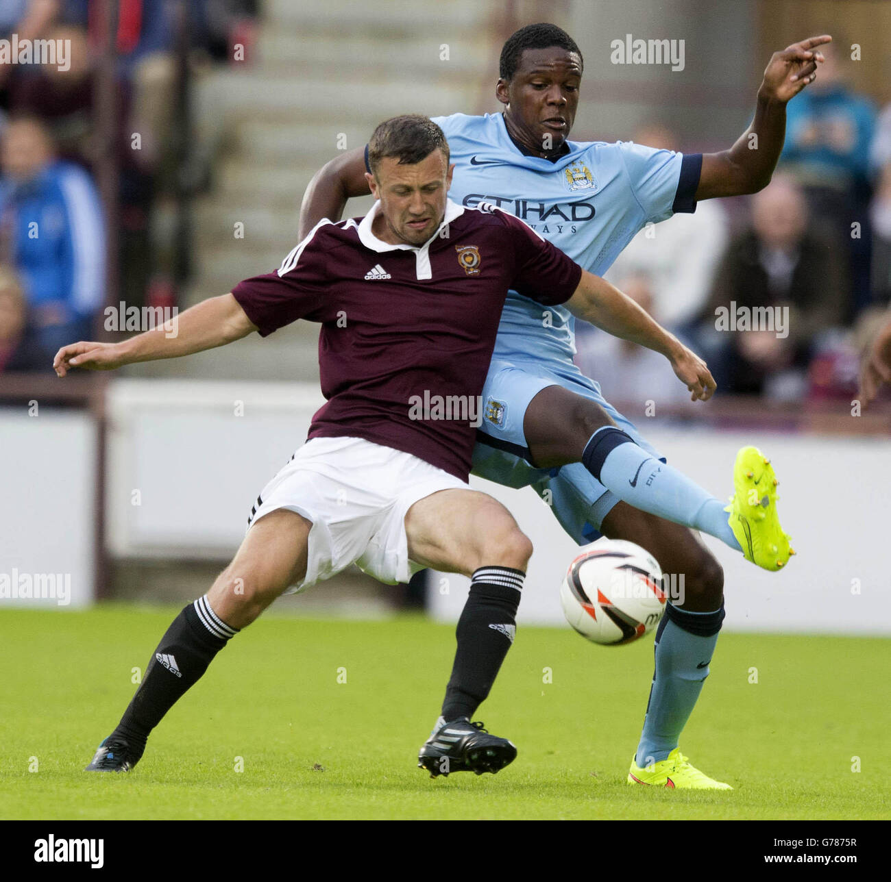 Hearts Dale Carrick (left) and Manchester City's Dedryck Boyata during ...