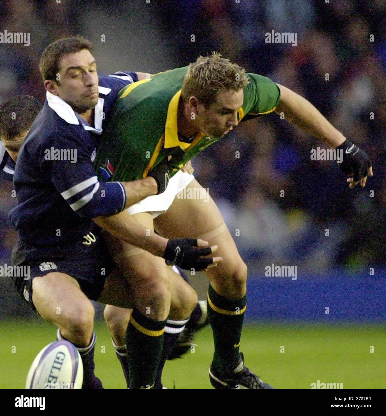 Scotland`s Bryan Redpath (left) tackles South Africa`s Robbie Fleck ...