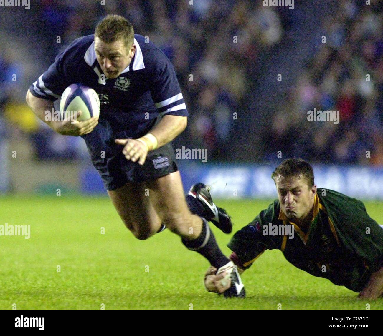 Scotland`s Brendan Laney (left) goes past South Africa`s Jannes ...