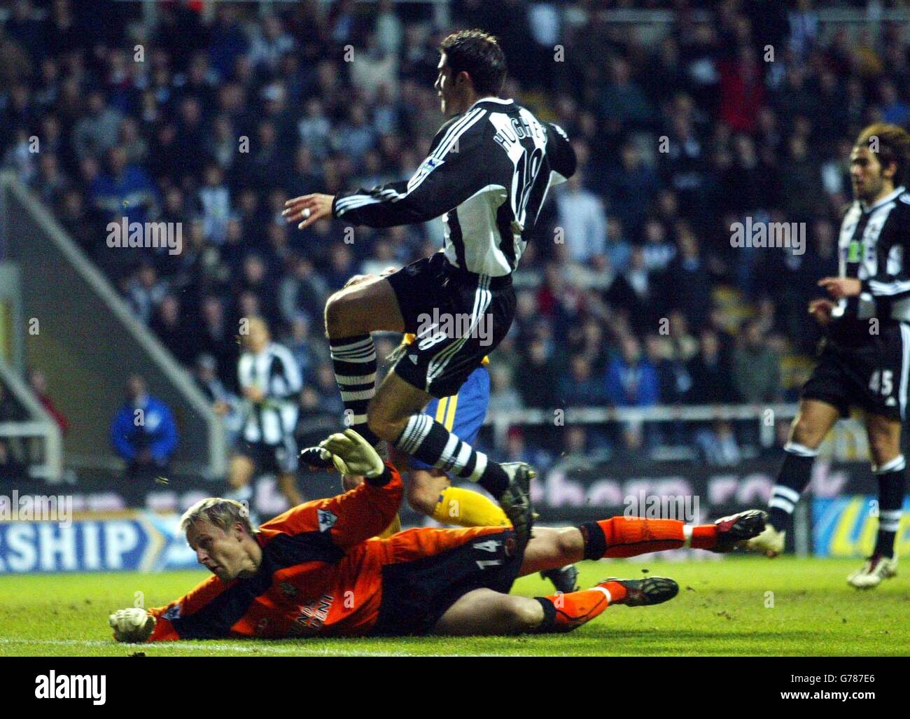 Newcastle United's Aaron Hughes (centre top) scores the second goal ...