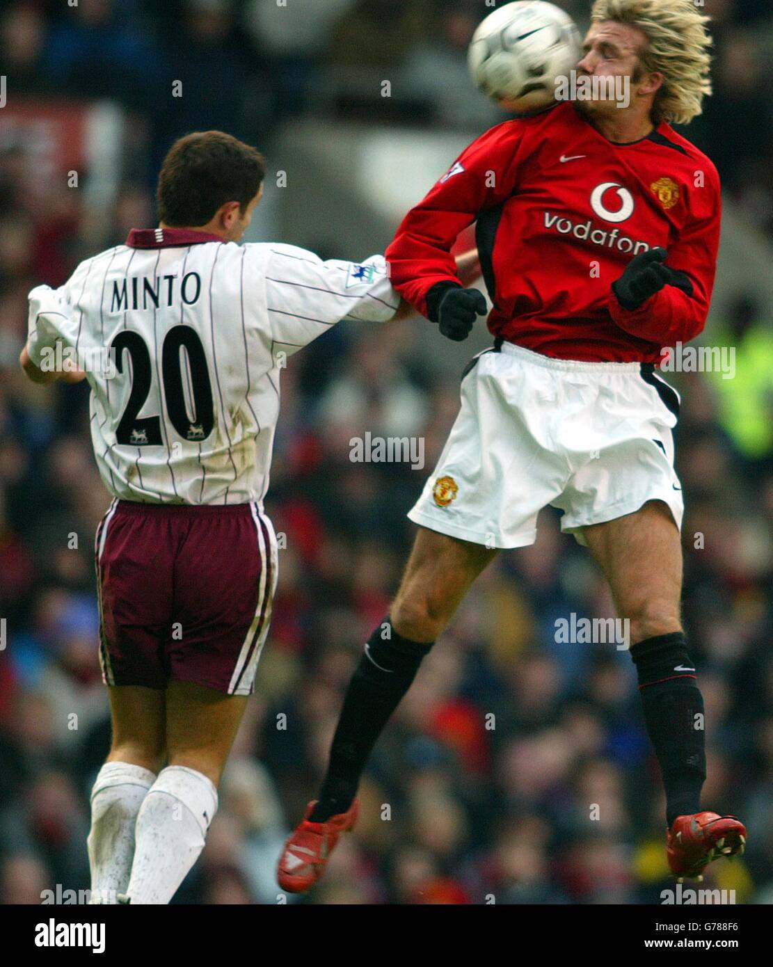 Manchester United's David Beckham challenges Scott Minto of West Ham ...