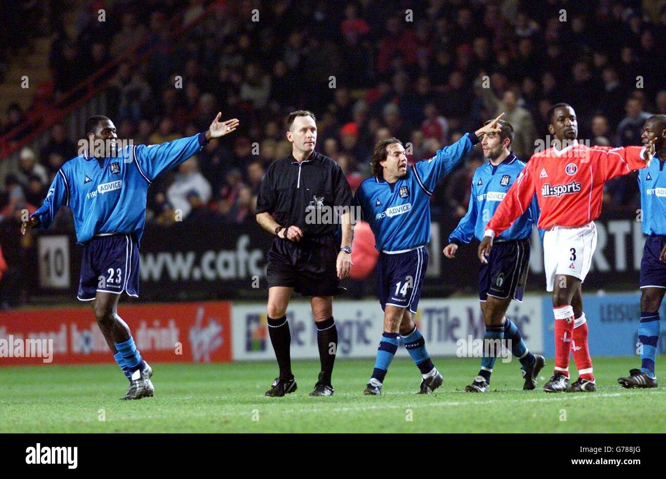 Manchester city players appeal to referee David Pugh for a penalty ...