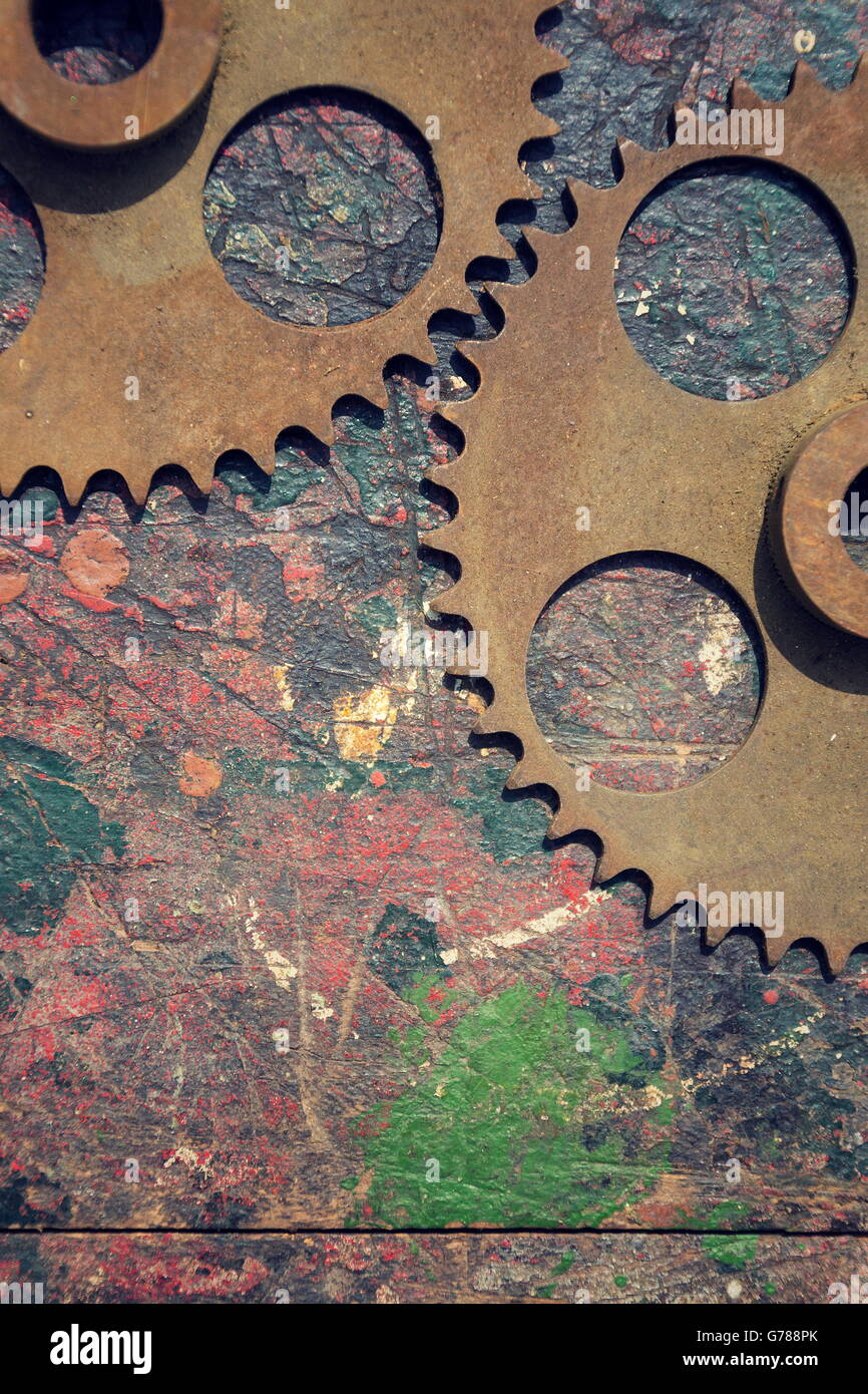 Filtered picture of cogwheels on a colorful wooden background Stock ...