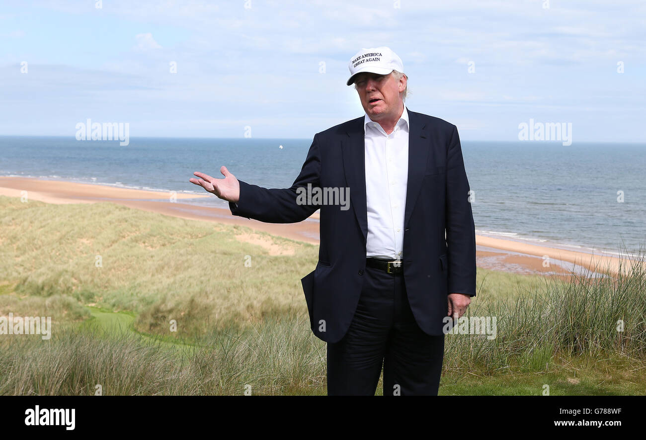 Donald Trump chats with the media on the 14th tee whilst on a tour of ...