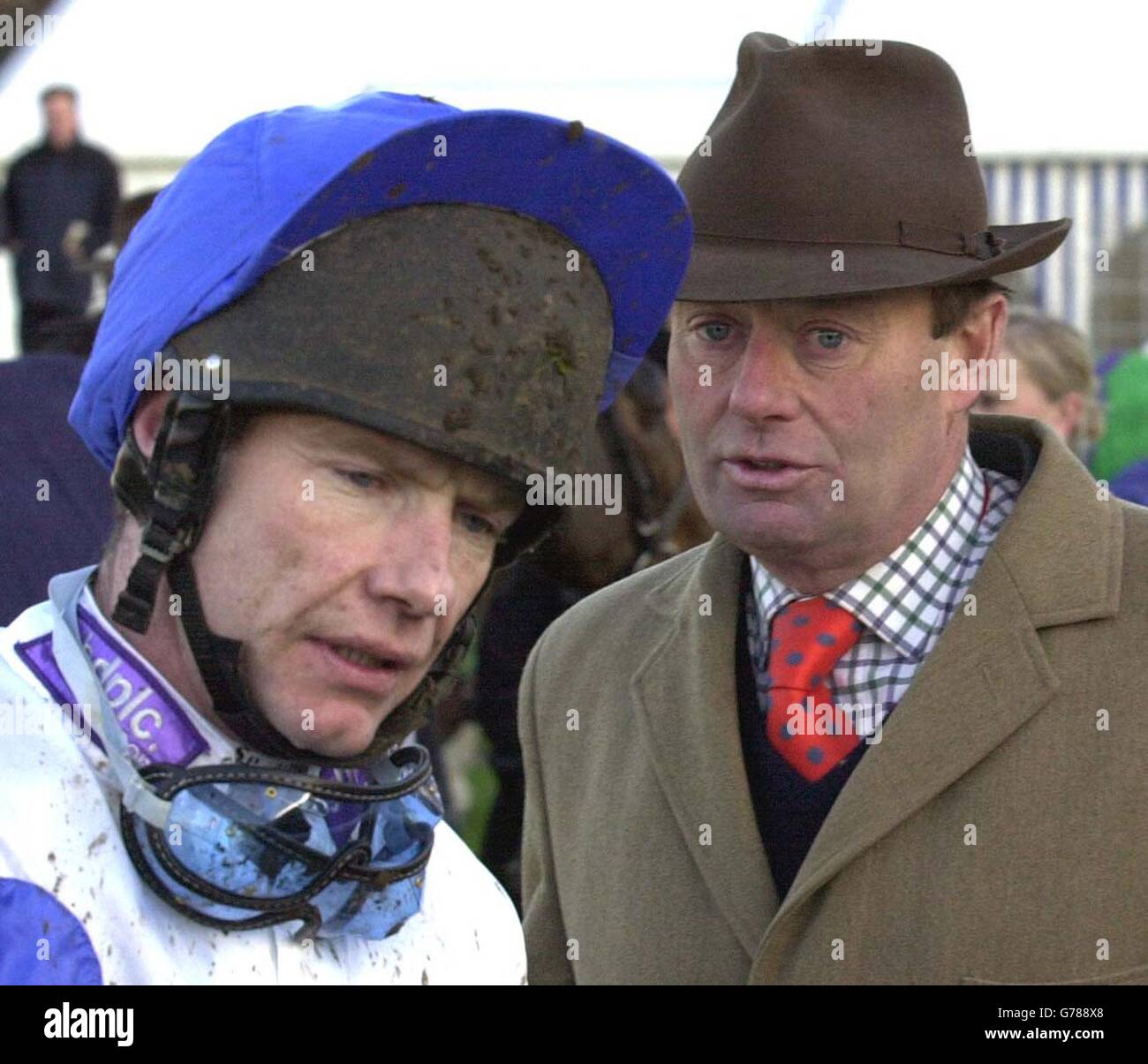 Jockey Mick FitzGerald with trainer Nicky Henderson after they winning ...