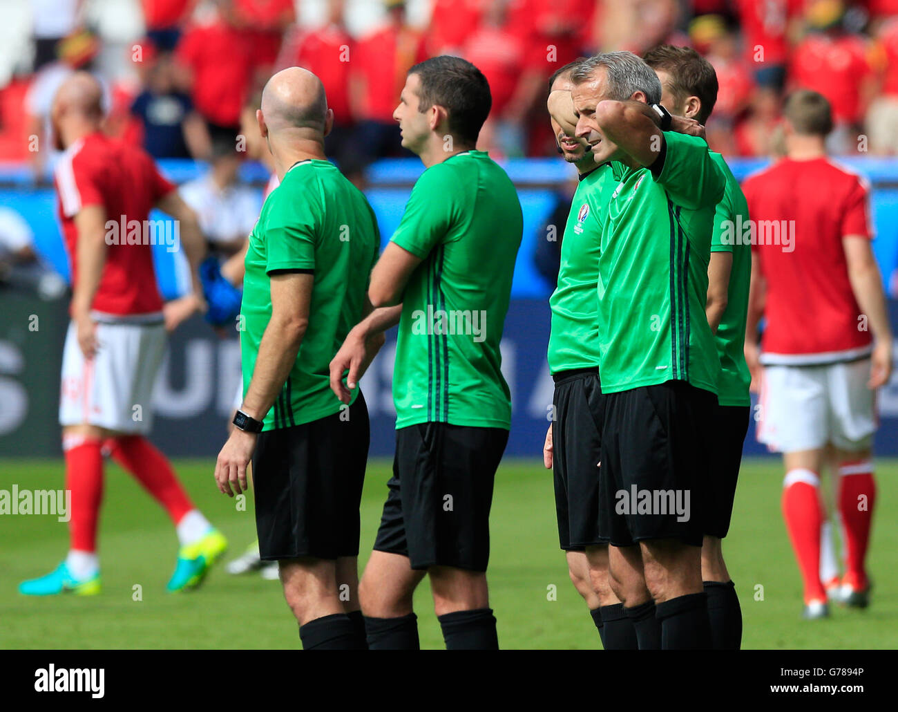 Referee Martin Atkinson (right) walks onto the pitch during the round ...