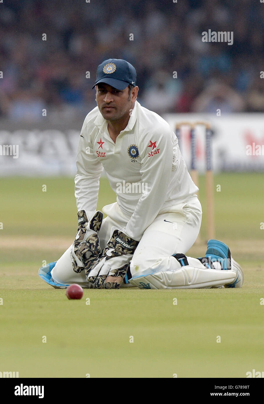 India's MS Dhoni looks-on following a mis-field during day five of the ...