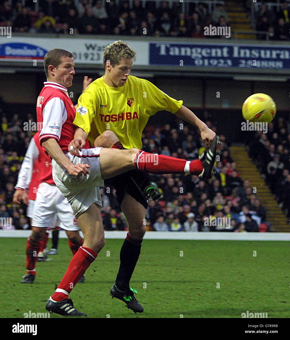 Rotherham's Chris Swailes (left) tussles with Watford's Heidar Helguson ...