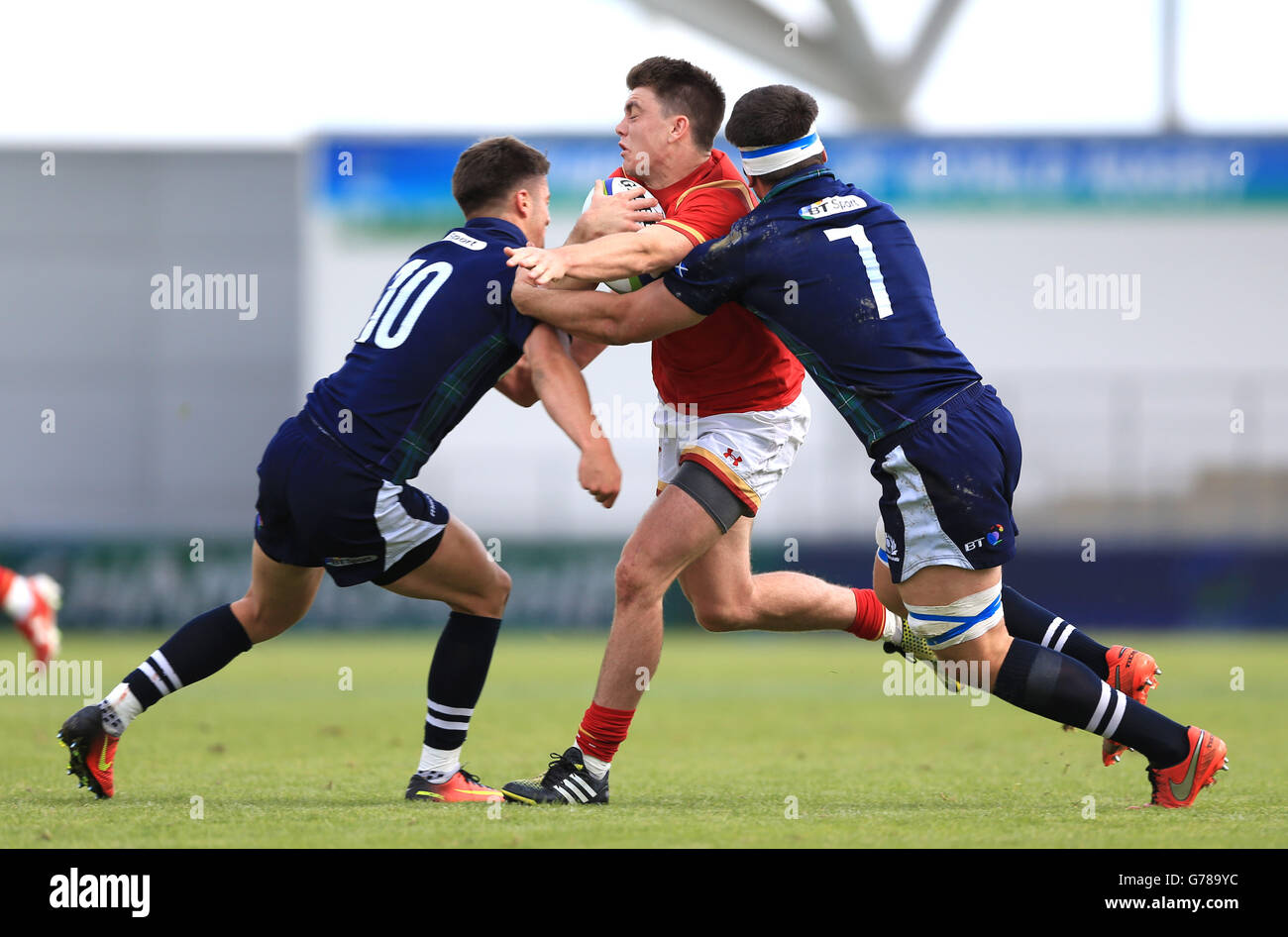 Scotland's Adam Hastings (left) and Lewis Wynne (right) tackle Wales ...