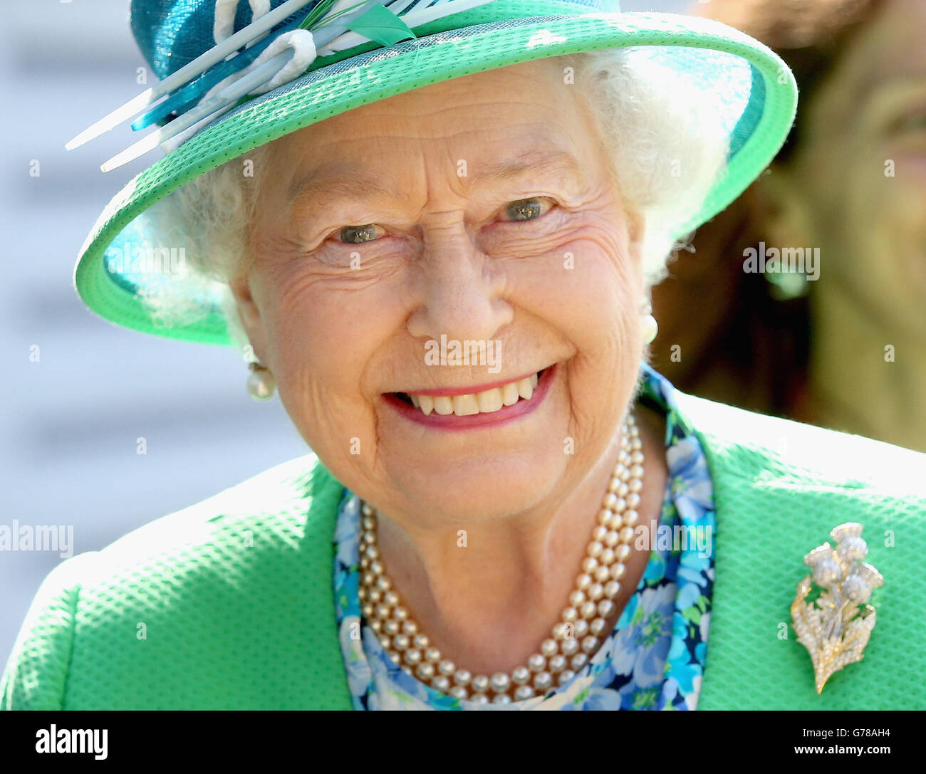 Queen Elizabeth II during a visit to the Glasgow National Hockey Centre ...
