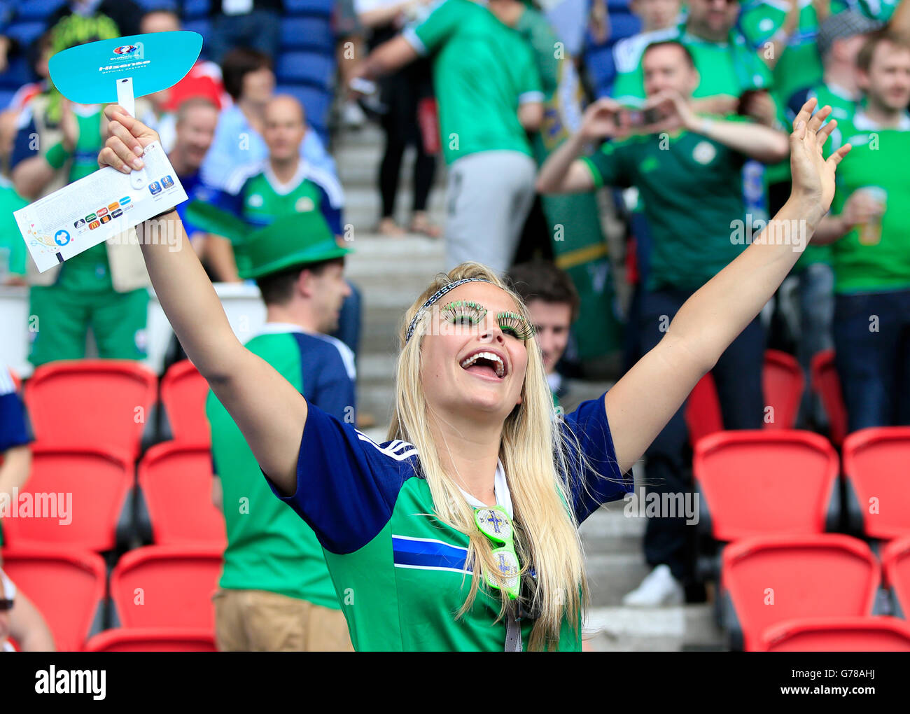 A Northern Ireland fan in the stands shows her support during the round ...