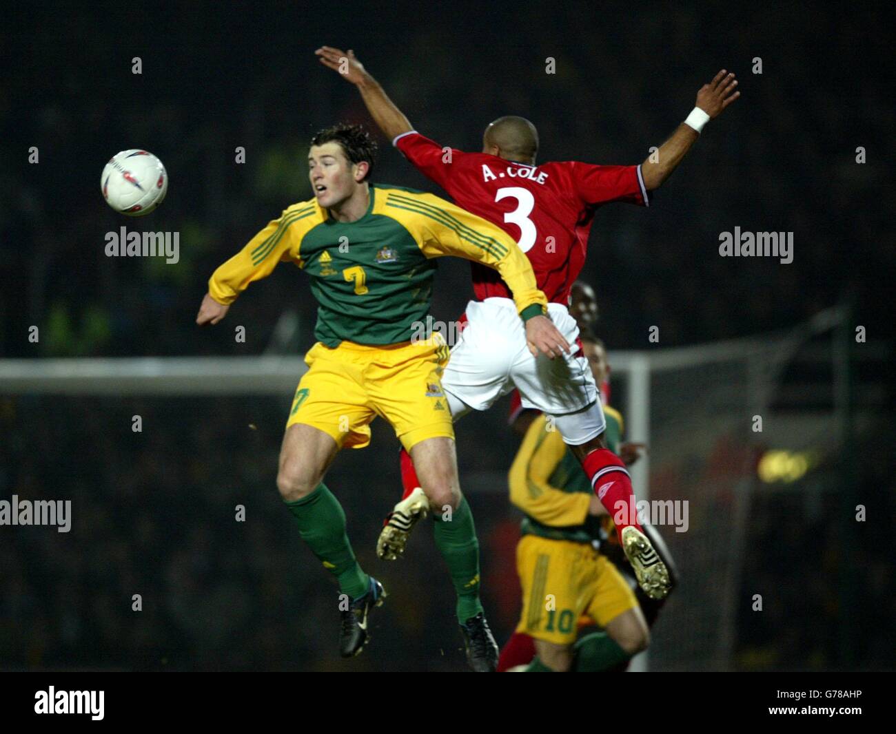 Australia's Brett Emerton in mid-air action against England's Ashley ...