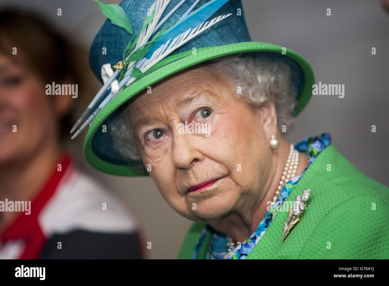 Queen Elizabeth II watches swimming heats as she visits the Tollcross ...