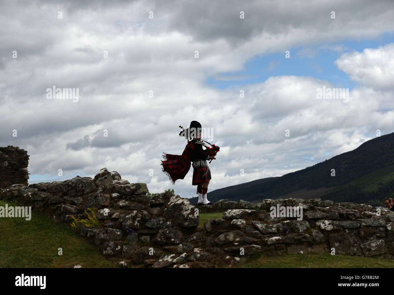 Calum Fraser, also known as Spud the Piper, entertaining visitors to ...
