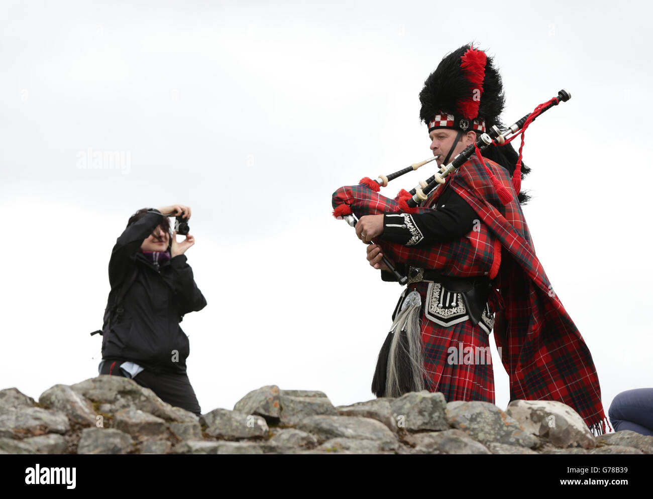 Calum Fraser, also known as Spud the Piper, entertaining visitors to ...