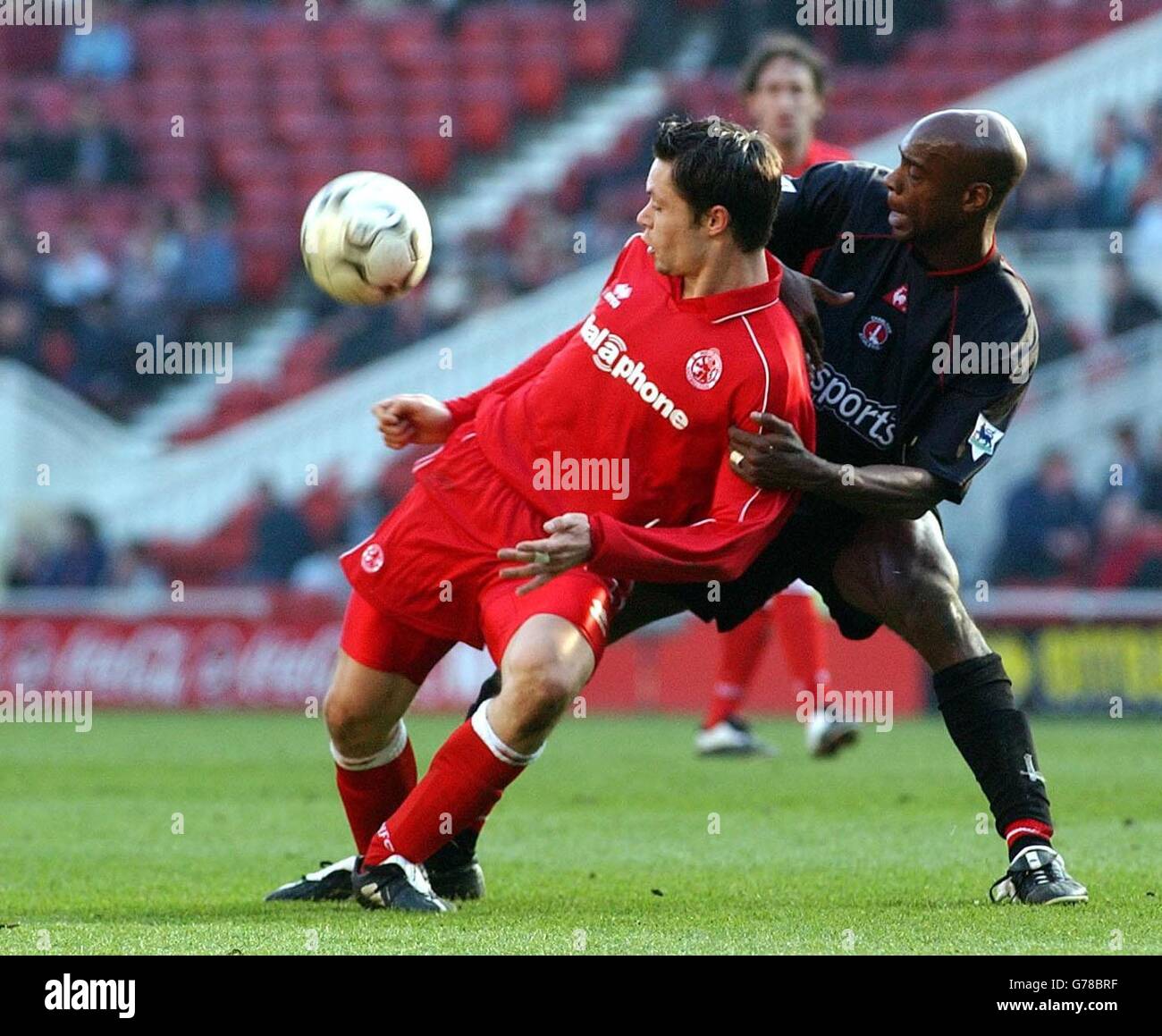 Middlesbrough's Malcom Christie (left) holds off Richard Rufus of ...