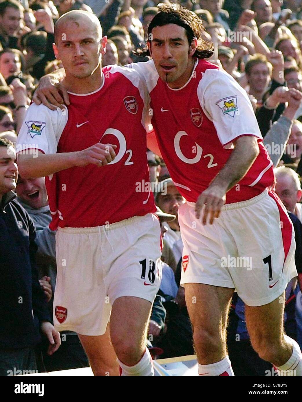Arsenal's Pascal Cygan (left) celebrates scoring with Robert Pires ...