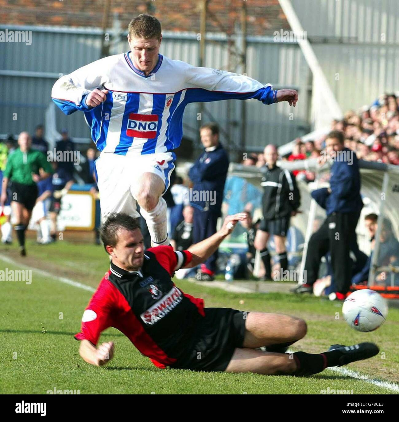 Hartlepool's Eifon Williams (above) goes past Bournemouth's Carl ...