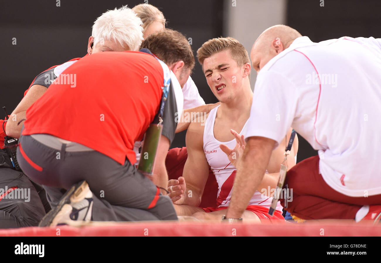 England's Sam Oldham is attended to by medical staff after suffering an ...