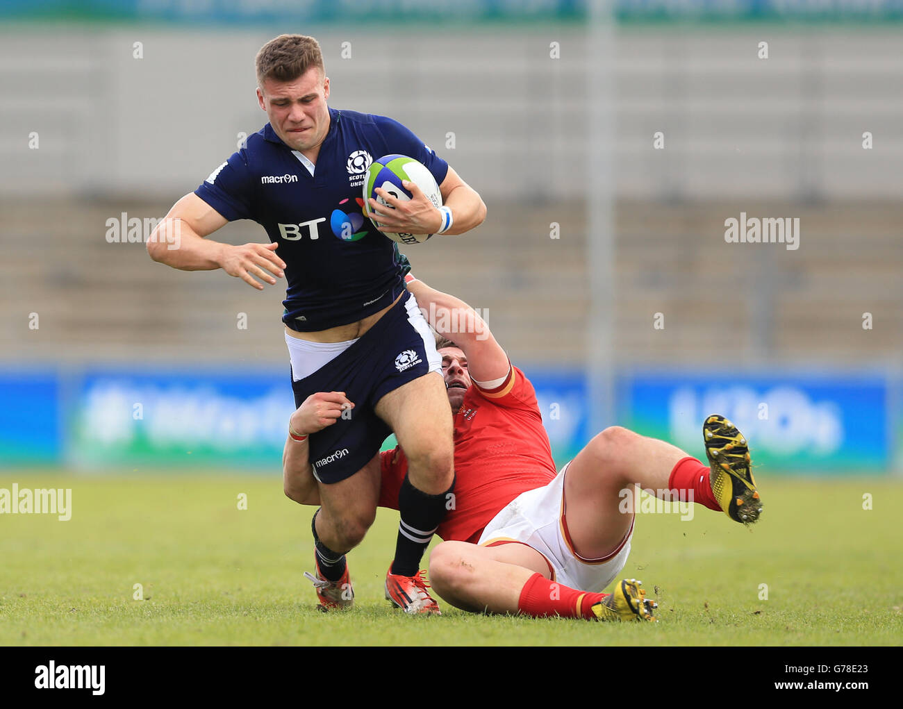 Scotland's Ben Robbins is tackled by Wales Harri Millard during the ...