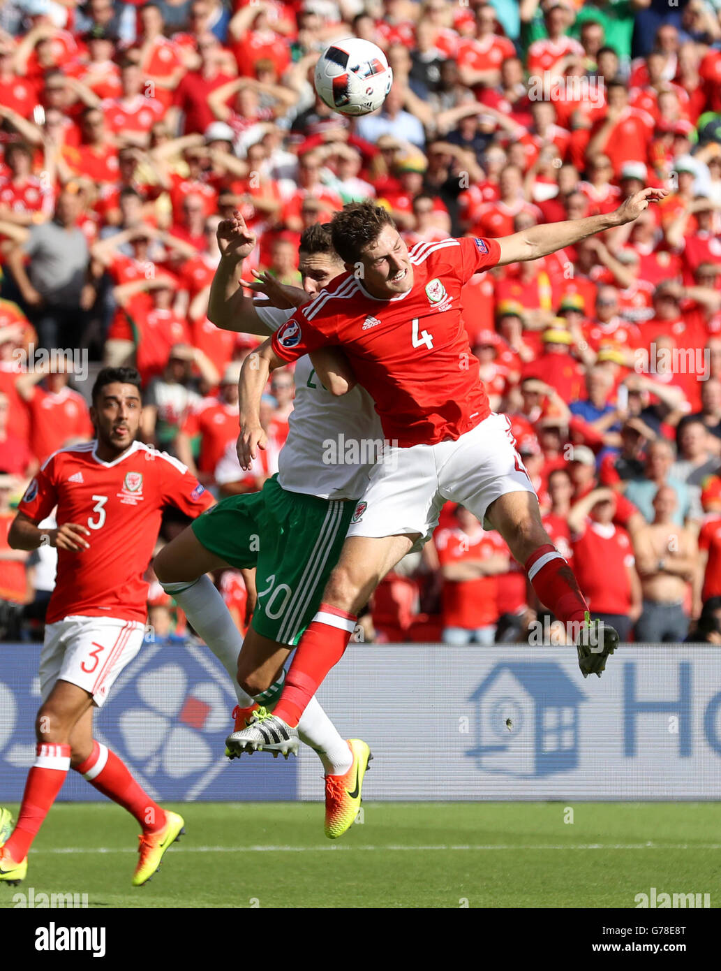 Northern Ireland's Craig Cathcart (left) and Wales' Ben Davies battle ...