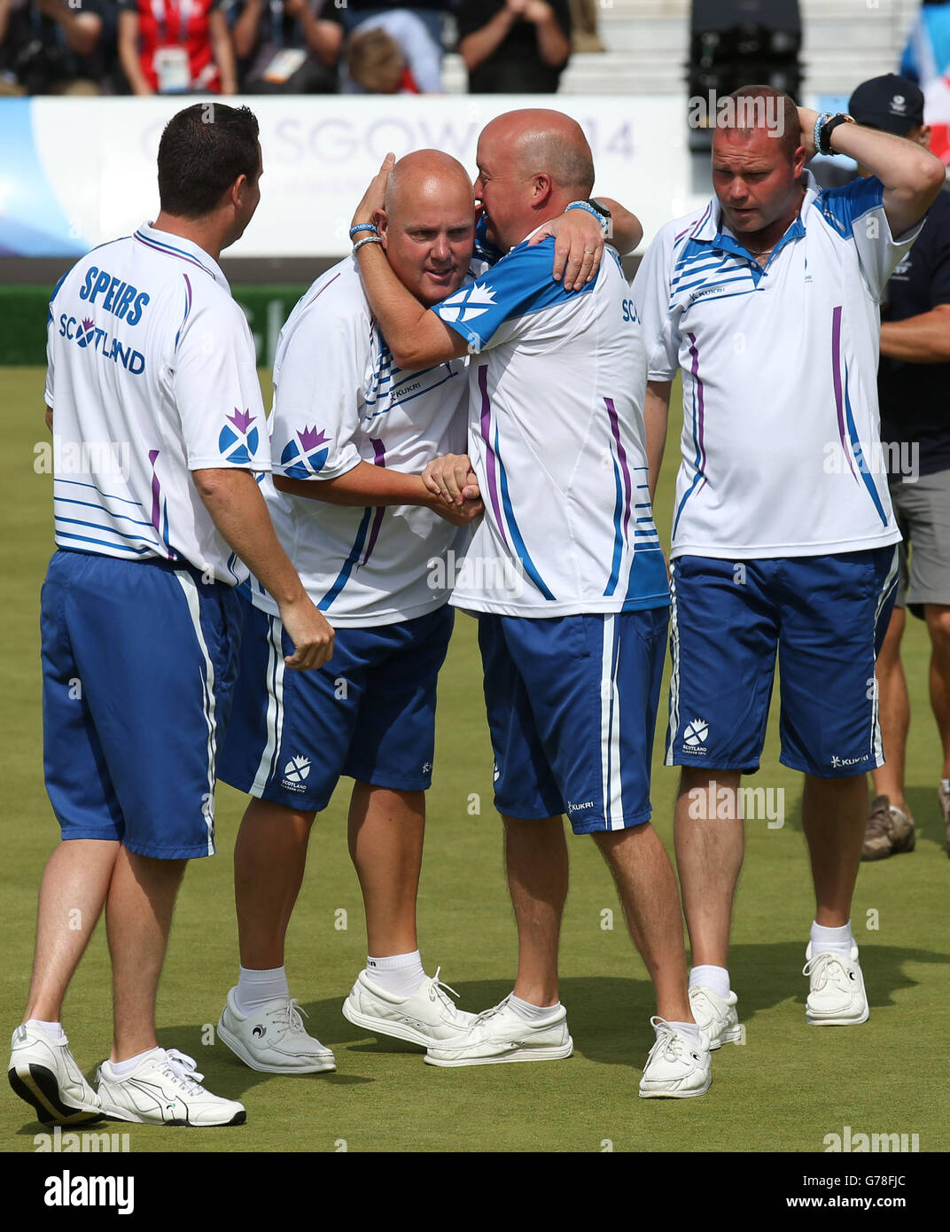 Scotland's Alex Marshall is hugged by David Peacock watched by Paul ...