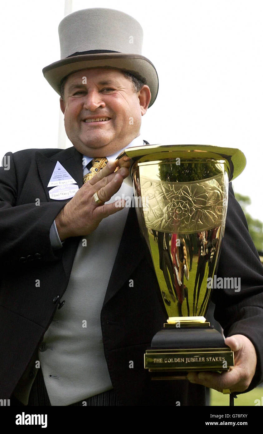 Choisir's trainer Paul Perry proudly holds the The Golden Jubilee ...