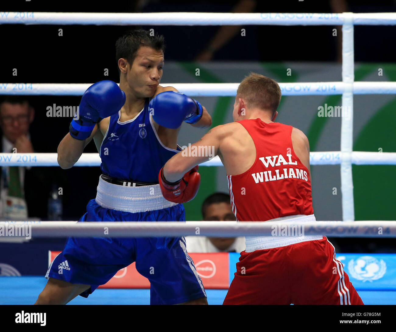 Wales' Ashley Williams (red) in action against India's Devendro ...
