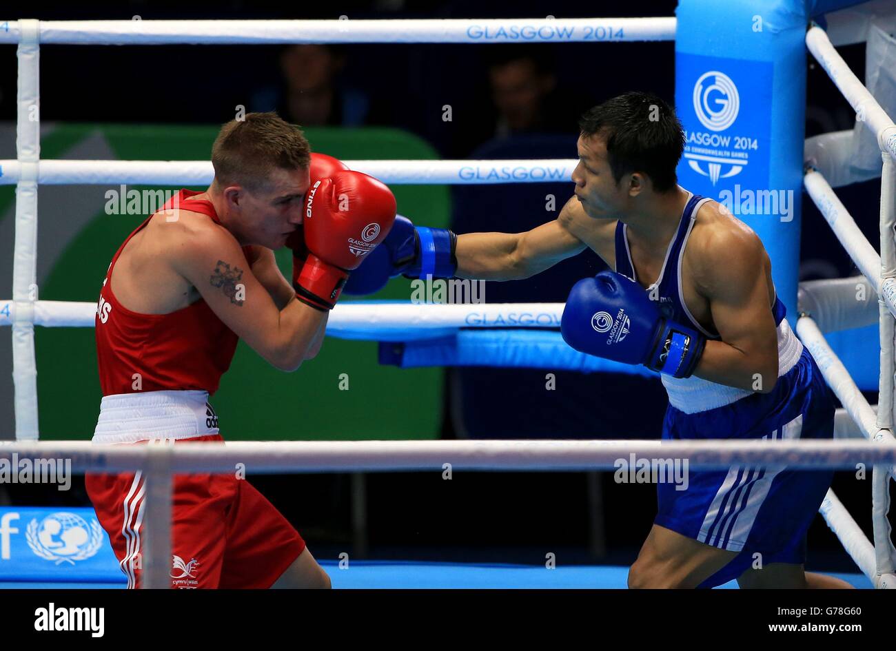 Wales' Ashley Williams (red) in action against India's Devendro ...