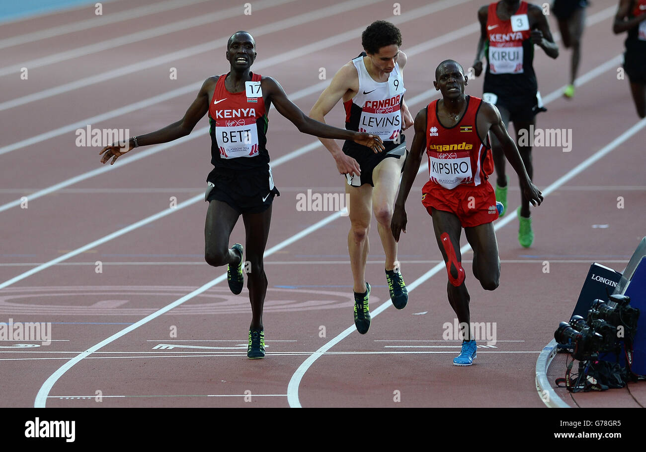 Sport - 2014 Commonwealth Games - Day Nine. Uganda's Moses Kipsiro (right) wins the Men's 10 ...