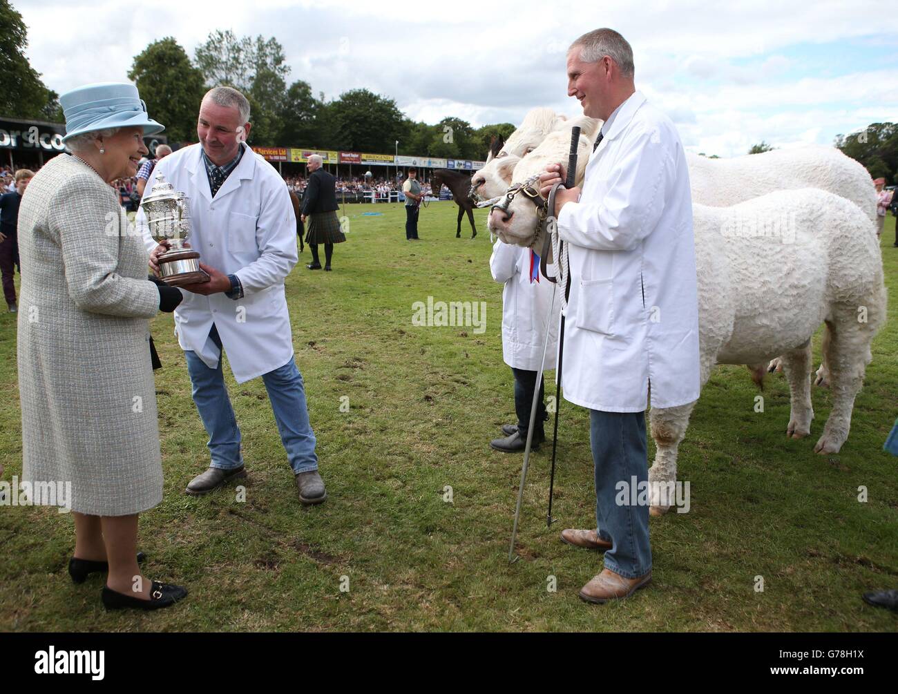 Queen Elizabeth II hands out the trophy for Champions of Champions as ...