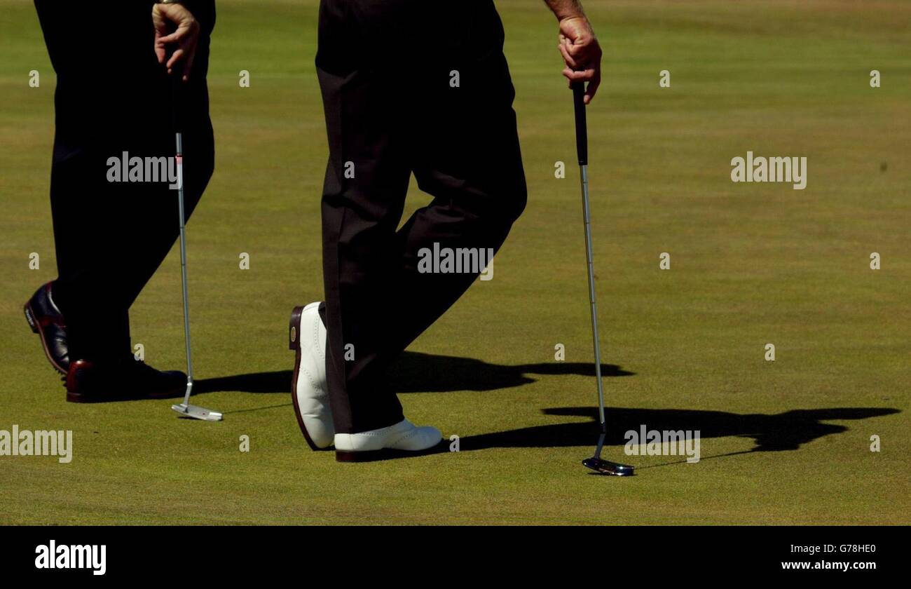 EDITORIAL USE ONLY, NO MOBILE PHONE USAGE : Two golfers take advantge ...