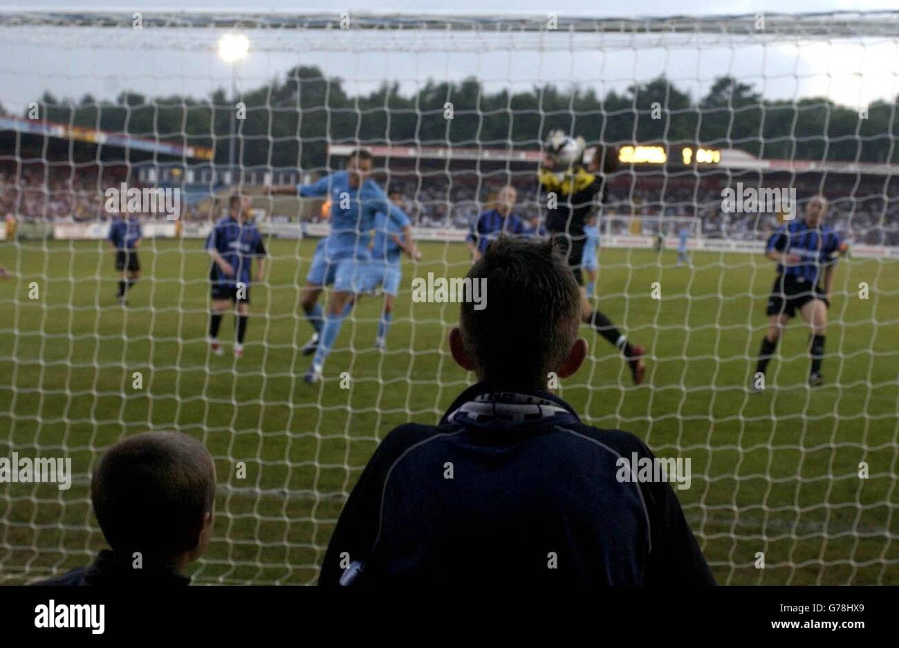 Young Spurs fans enjoy the return of the football after a summer break ...