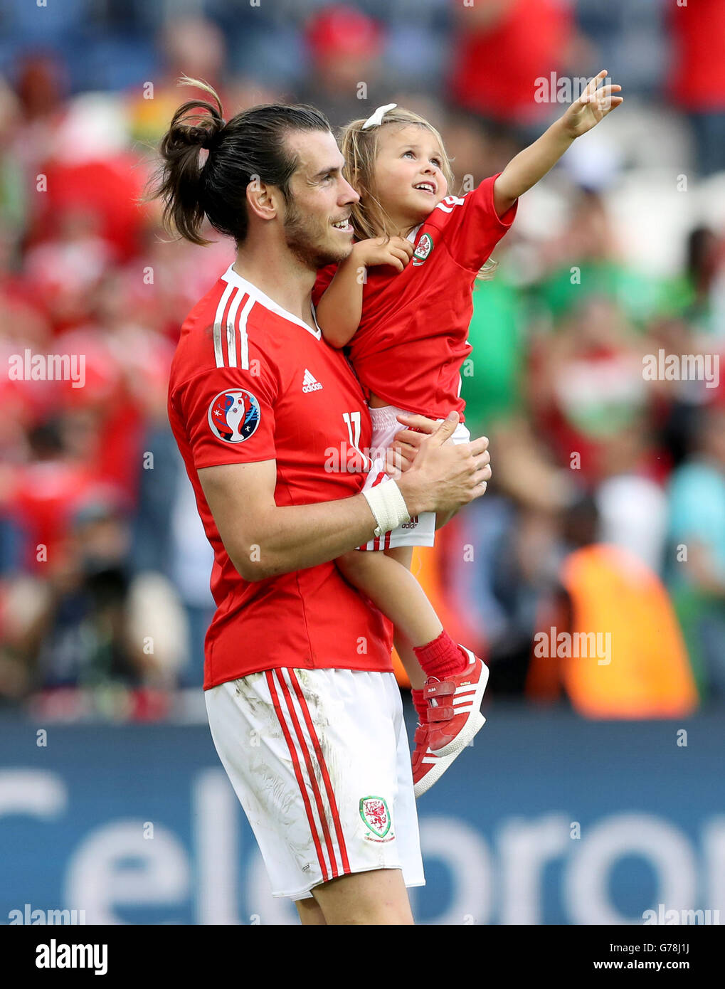 Wales' Gareth Bale celebrates with daughter Alba Violet on the pitch ...