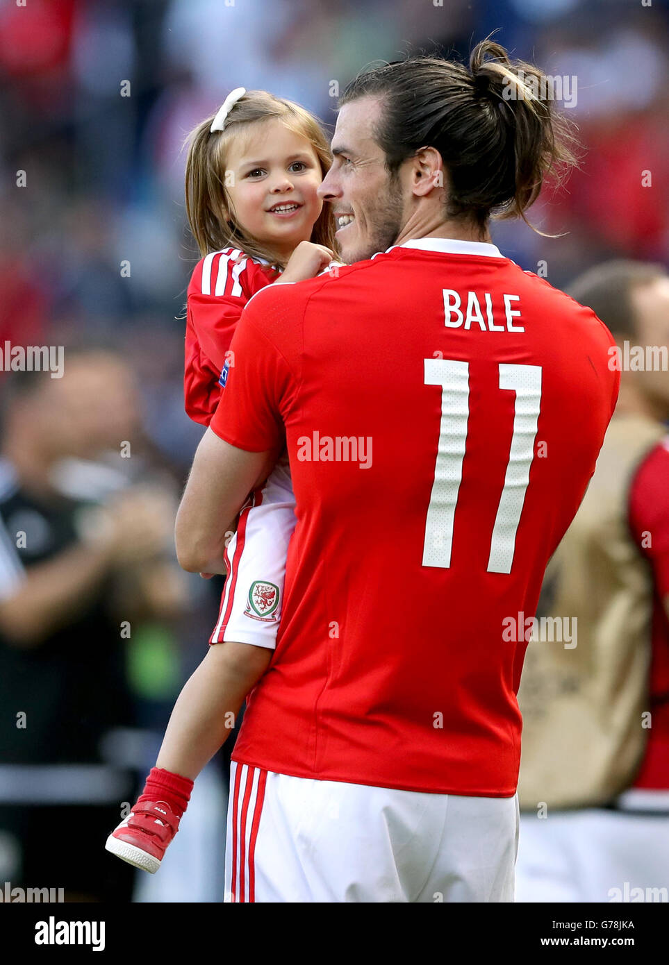 Wales' Gareth Bale celebrates with daughter Alba Violet on the pitch ...
