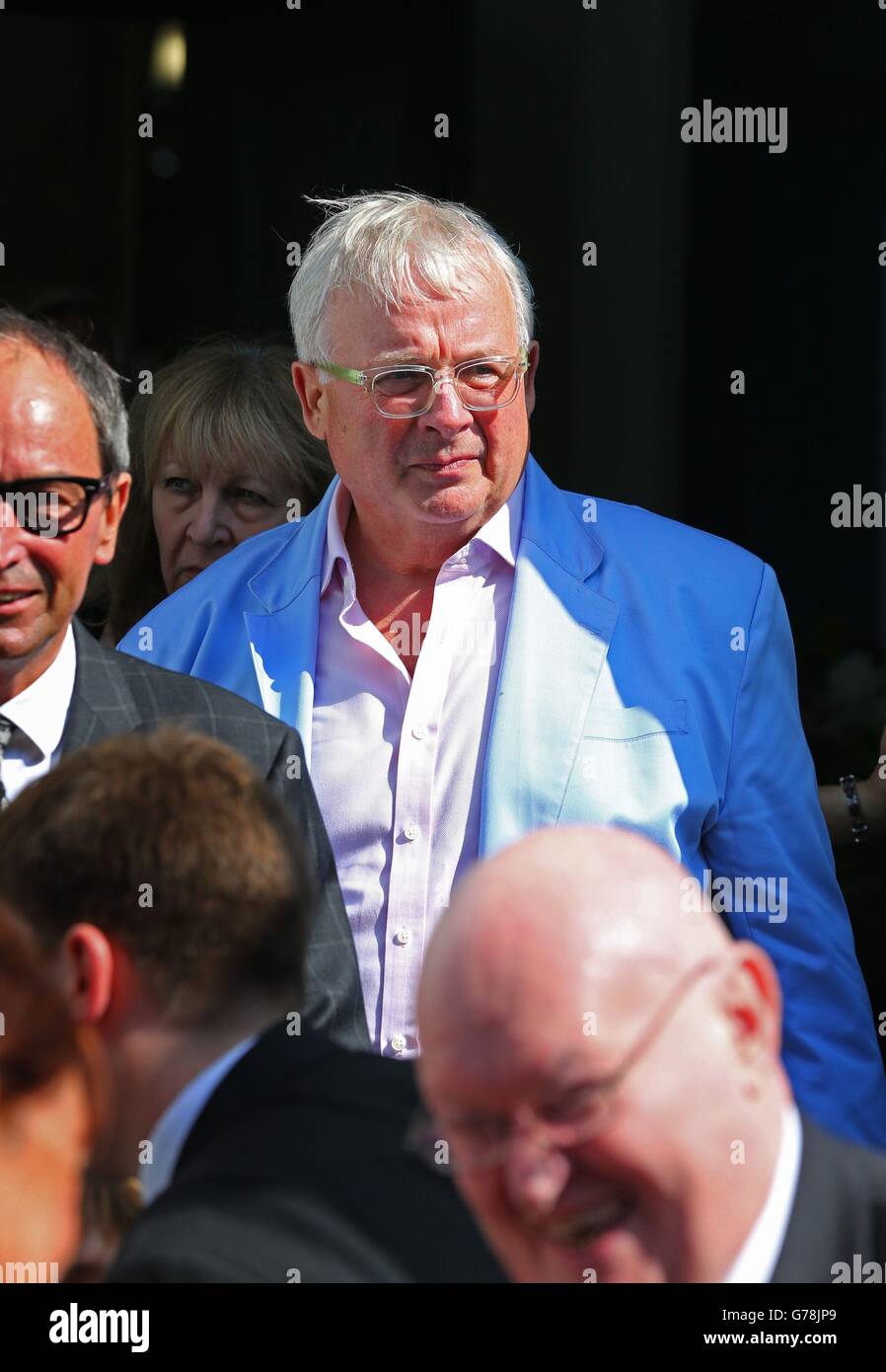 Christopher Biggins leaves the funeral of actress Dora Bryan at St ...