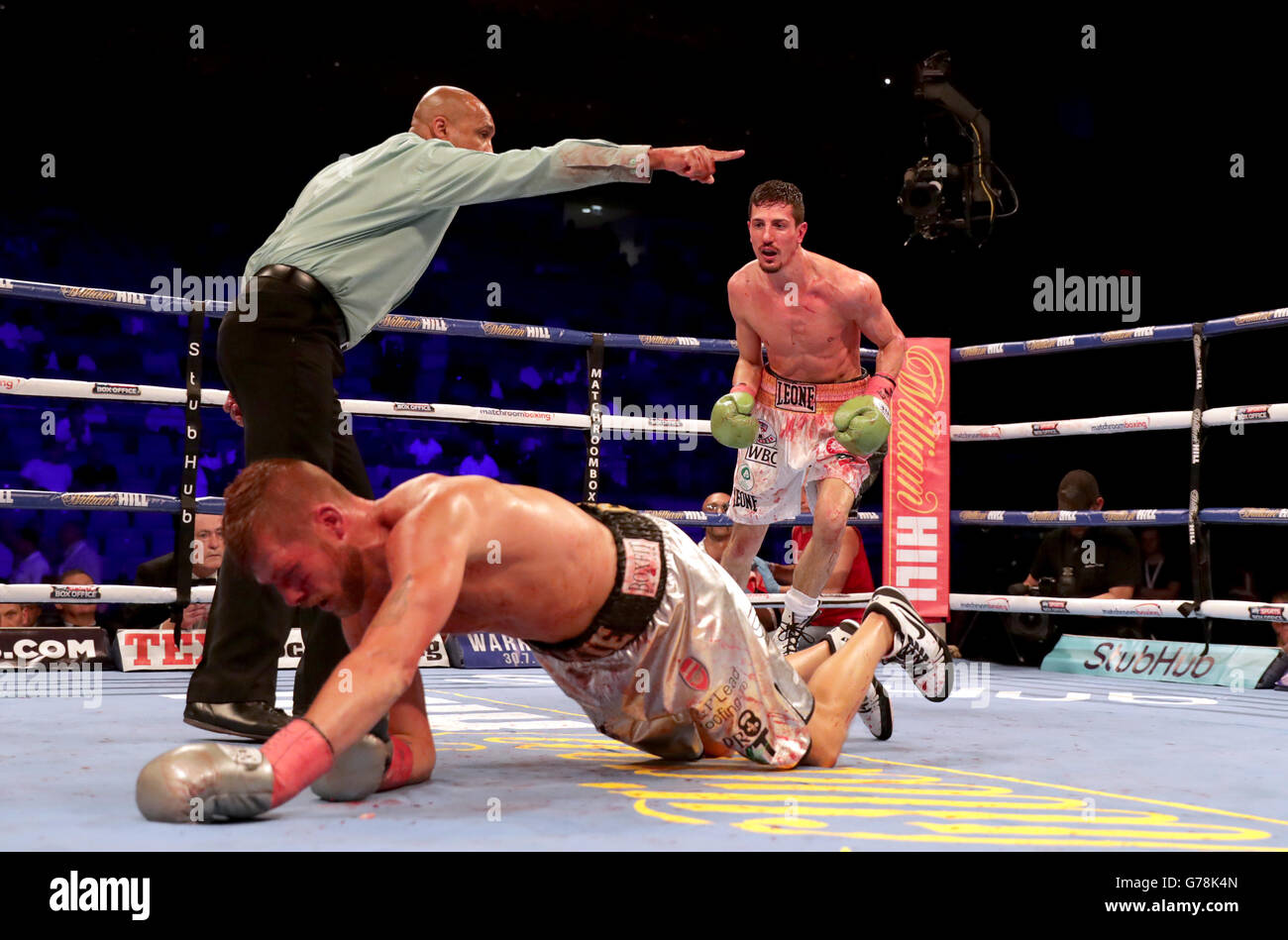 John Wayne Hibbert is knocked down by Andrea Scarpa during their WBC ...