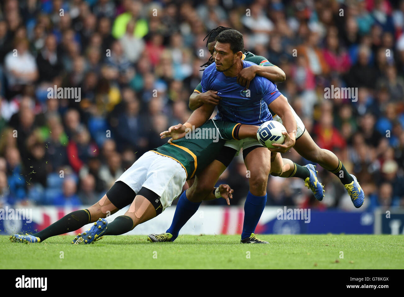 Samoa's Lio Lolo is tackled by South Africa's Cornal Hendricks and ...