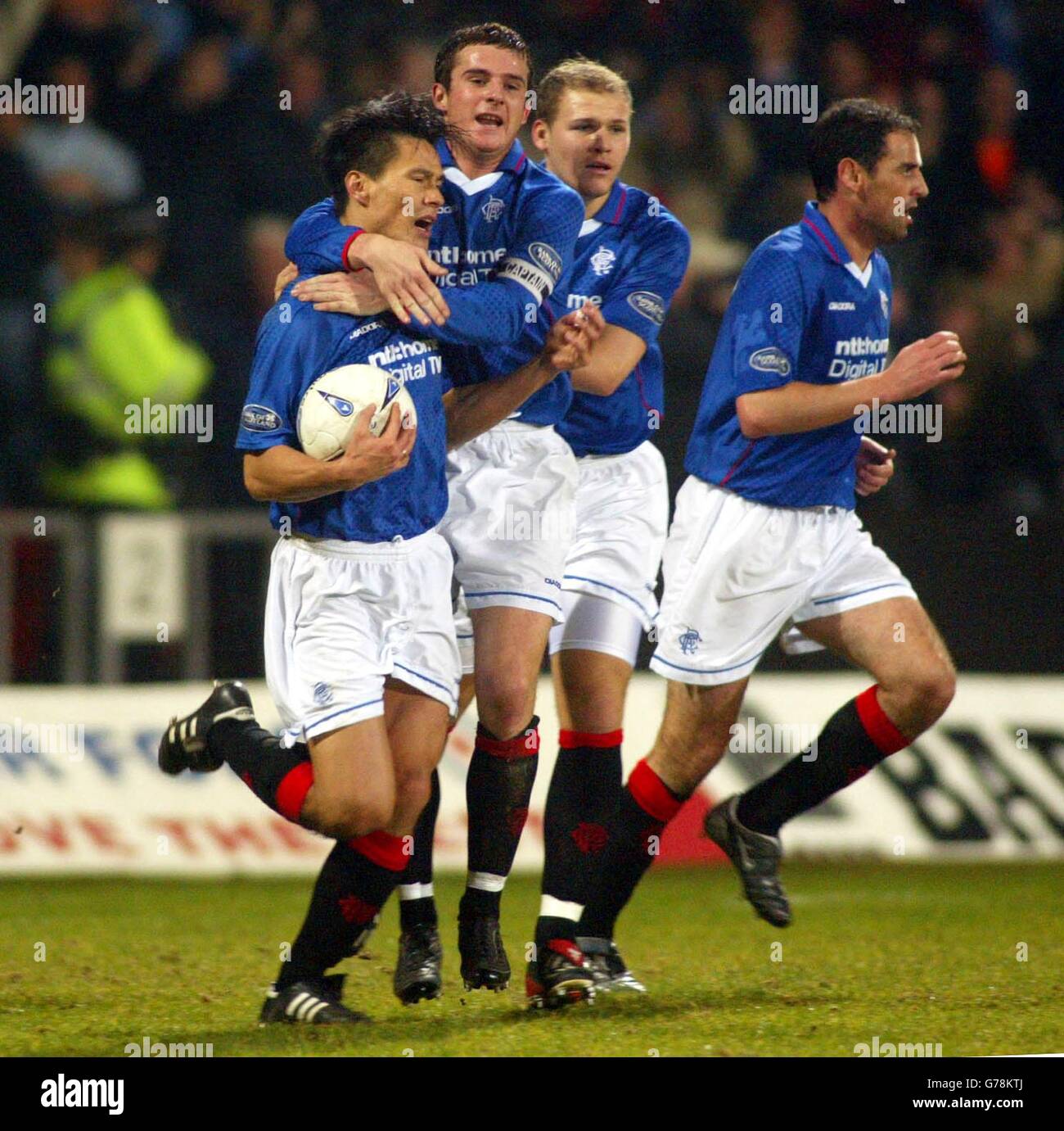 Michael Mols (left) celebrates his goal with Barry Ferguson, Robert ...