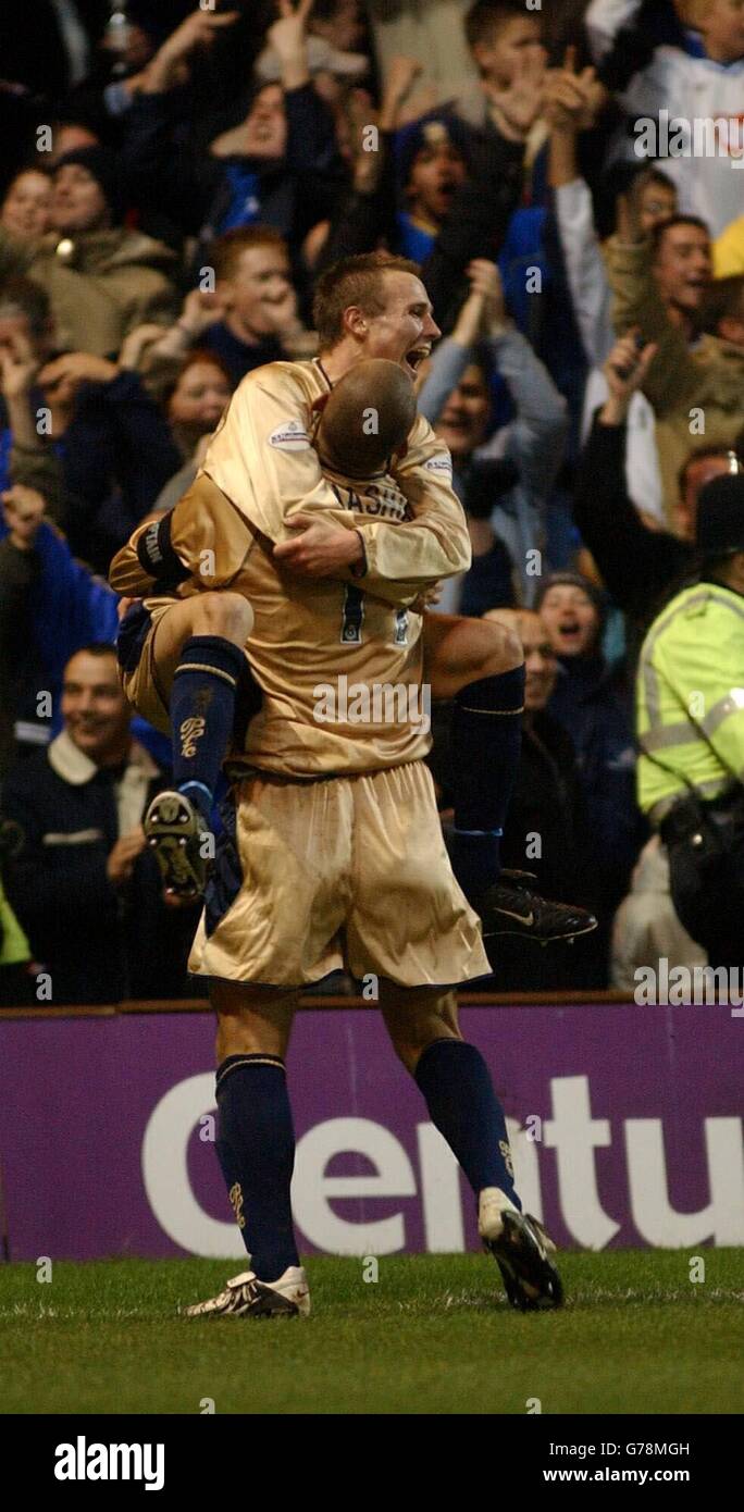 Portsmouth's Mathew Taylor (being lifted) and Nigel Quashie celebrate ...