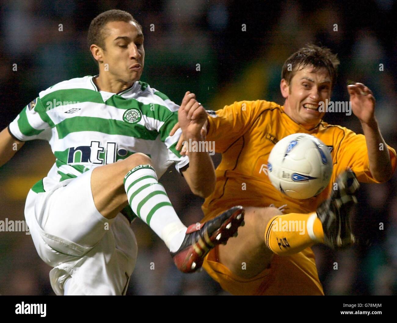 Celtic's Henrik Larsson scores past Dunfermline's Andre Skerla, during ...