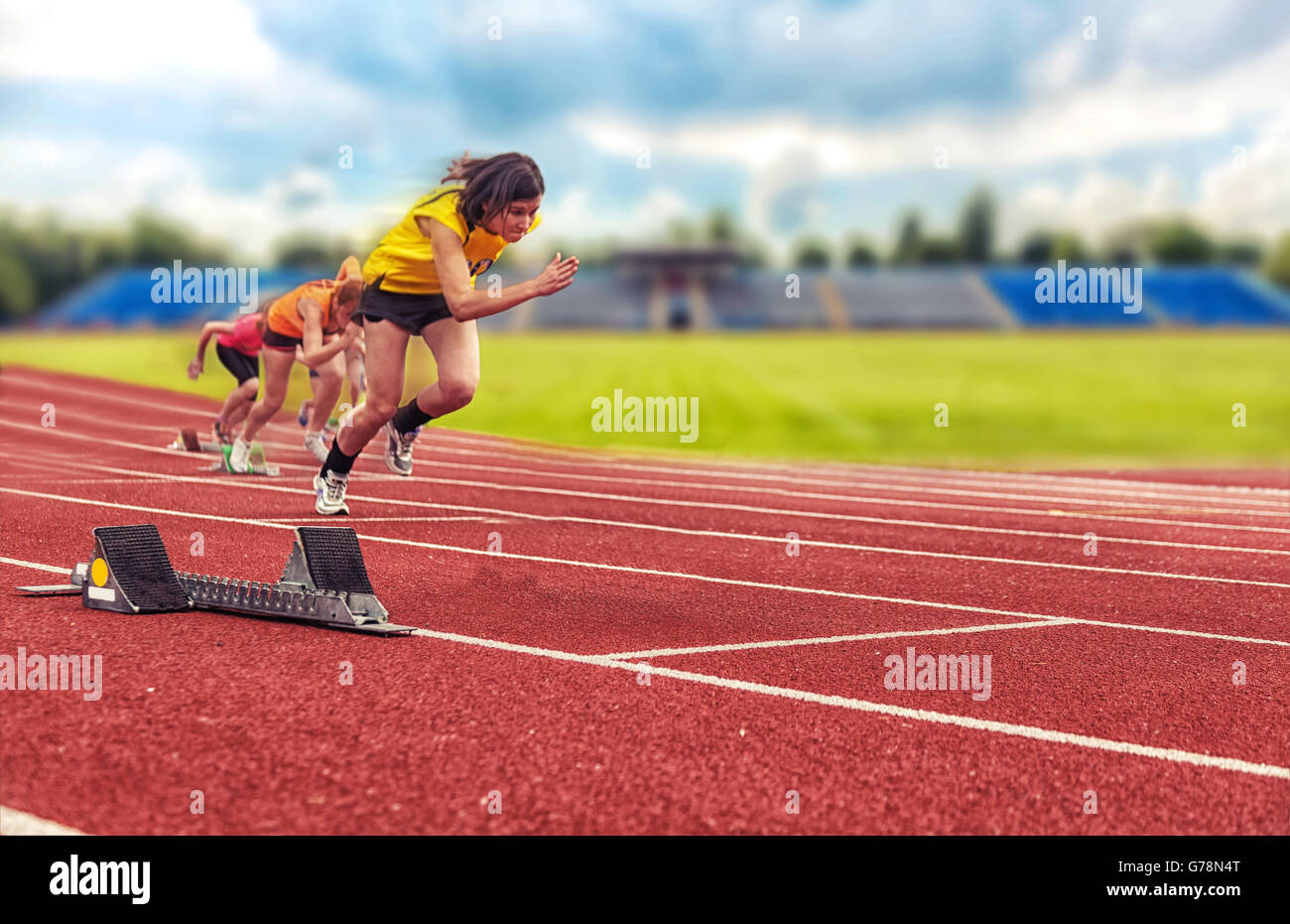Women starting the race in the stadium Stock Photo - Alamy