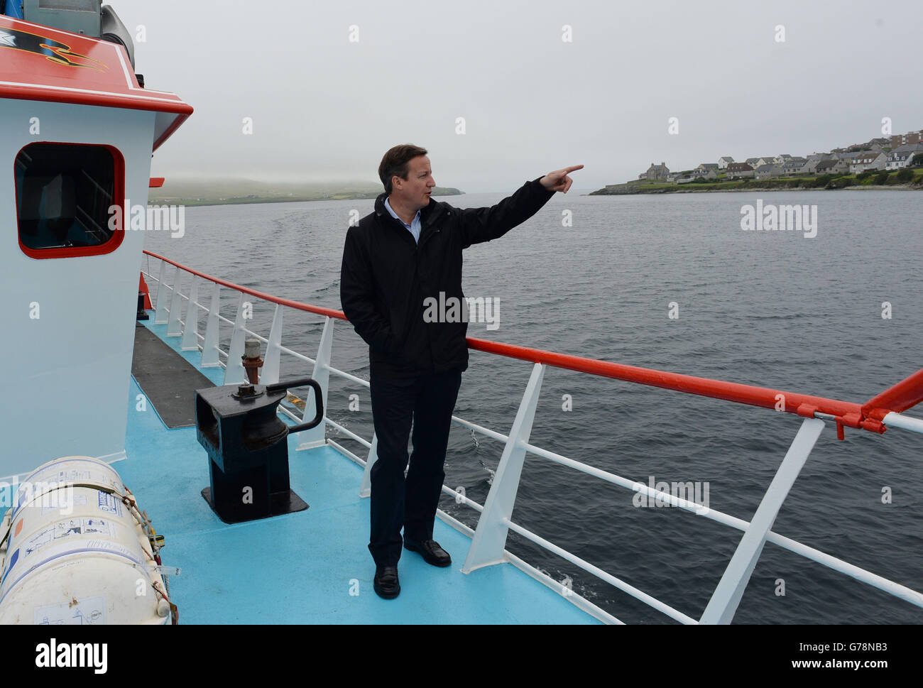 Prime Minister David Cameron as he taken out to sea on the fishing boat ...