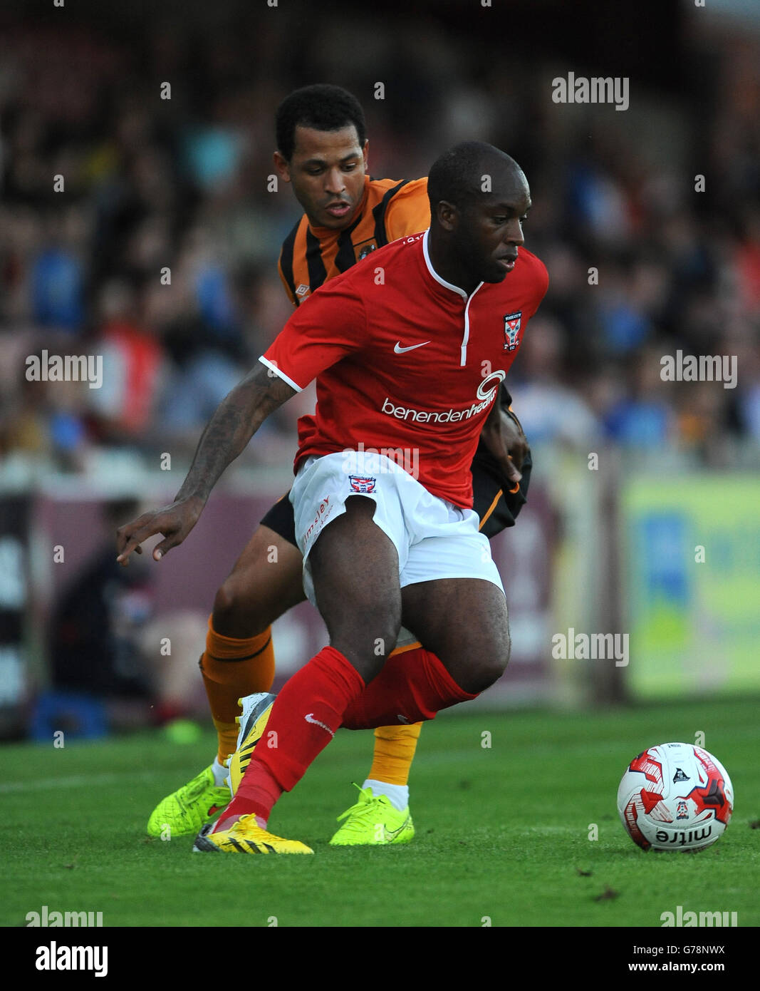 York City's Anthony Straker (front) and Hull City's Ahmed Elmohamady ...