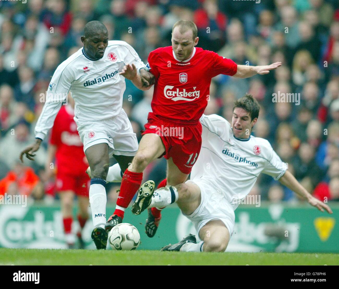 Liverpool's Danny Murphy (centre) is challenged by Geremi (left) and ...