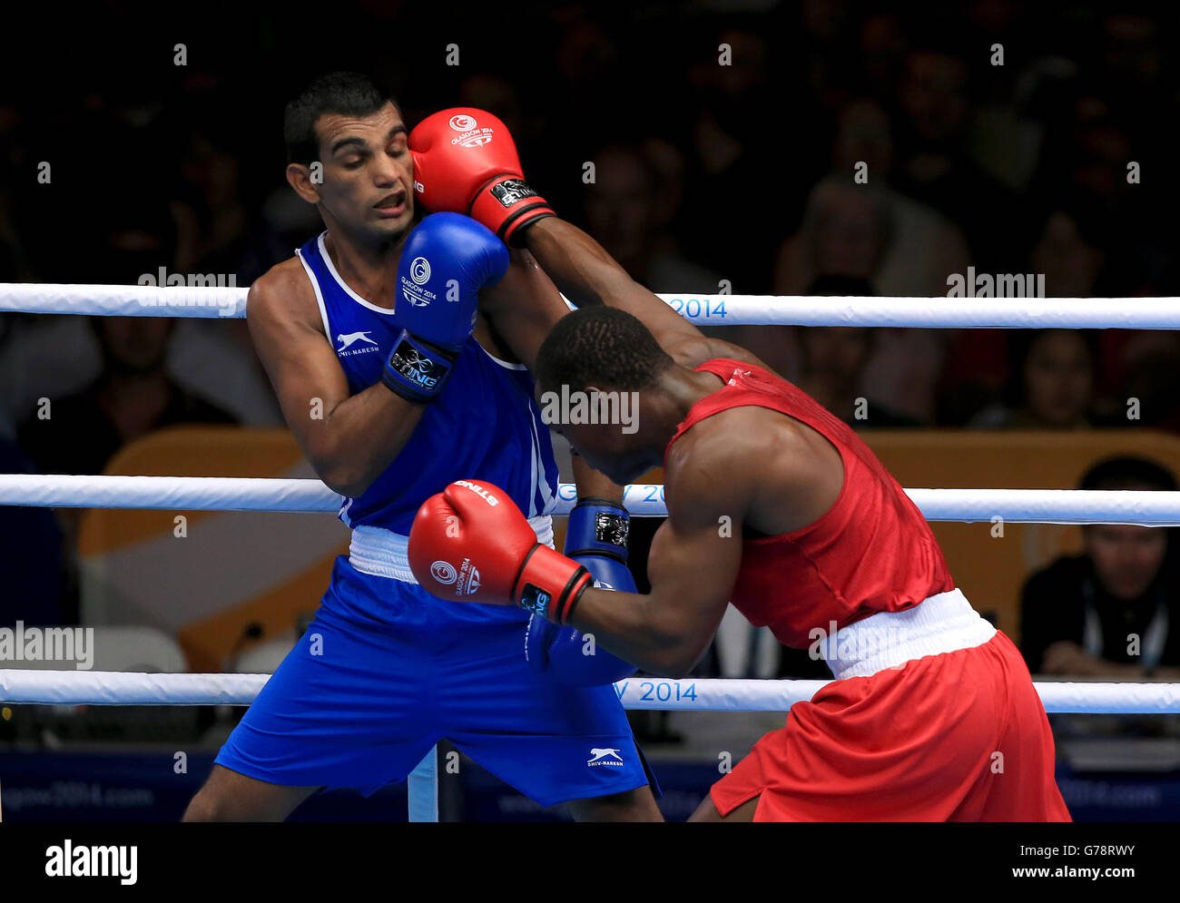 India's Mandeep Jangra (left) in action against Mozambique's Augusto ...