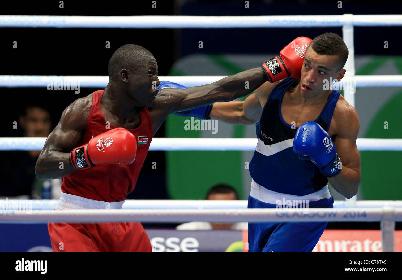 England's Samuel Maxwell (blue) in action against Kenya's Denis Okoth ...