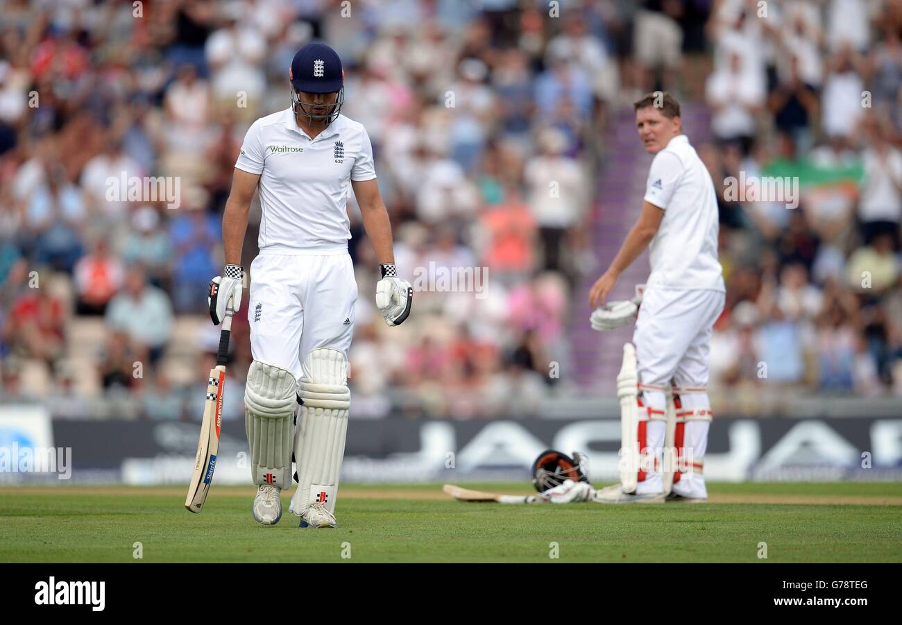 England captain Alastair Cook (left) looks dejected as he walks off ...